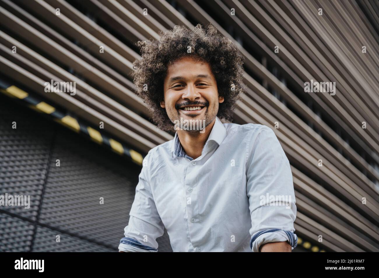 Modern young smiling man hi-res stock photography and images - Alamy