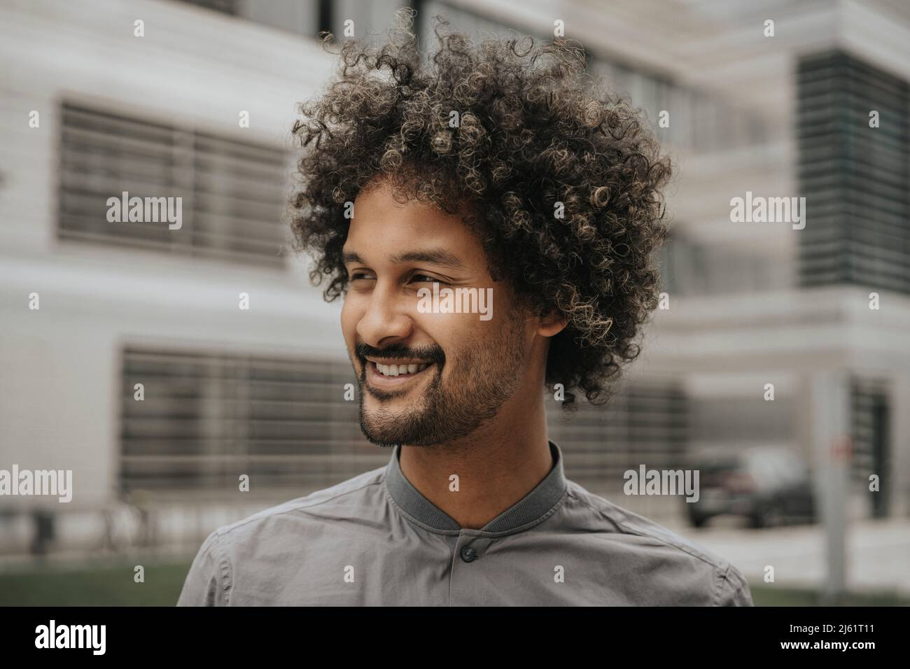 Modern young smiling man hi-res stock photography and images - Alamy