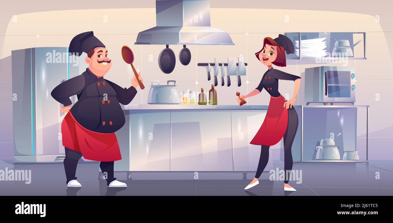 Chef and sous chef on kitchen. Restaurant staff in uniform stand at ...