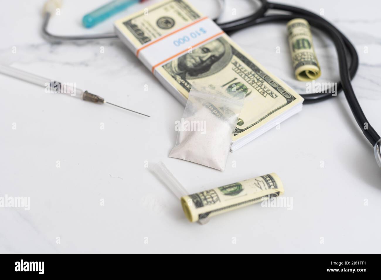 high costs of expensive medication concept , money and stethoscope ...