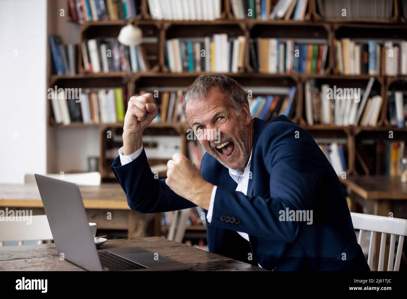 Excited businessman in wireless hi-res stock photography and images - Alamy