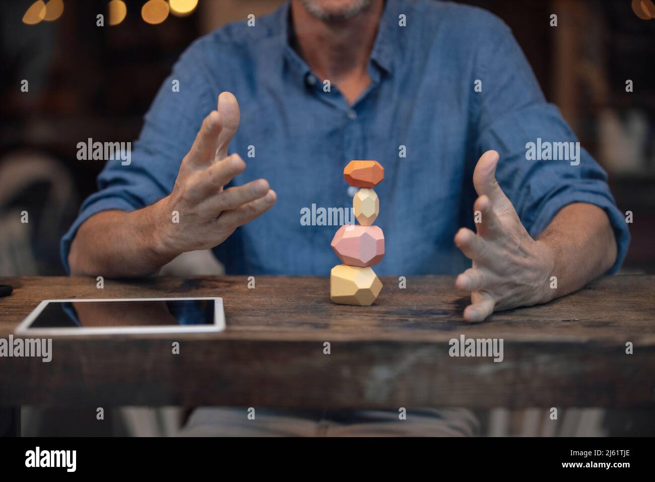 Man balancing stones hi-res stock photography and images - Alamy