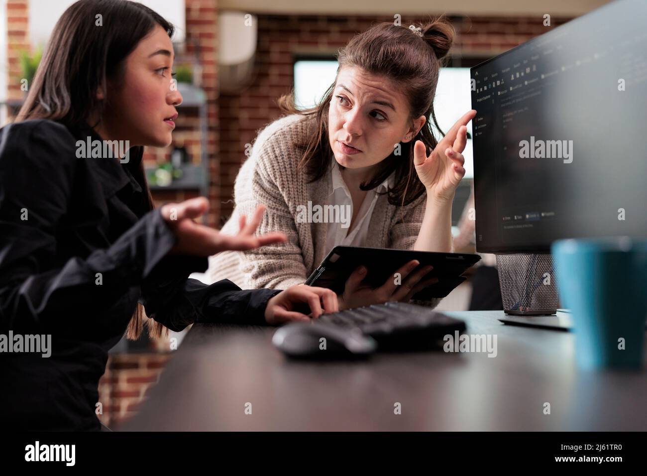 Unsure asian programming expert asking colleague about generated bug ...