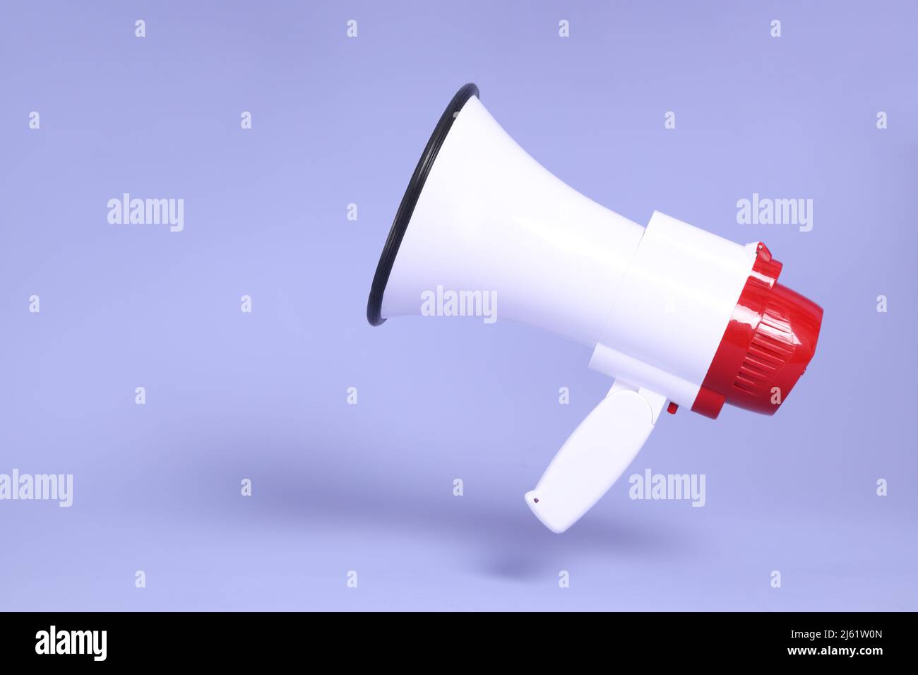 The isolated picture of megaphone floating on the purple background ...