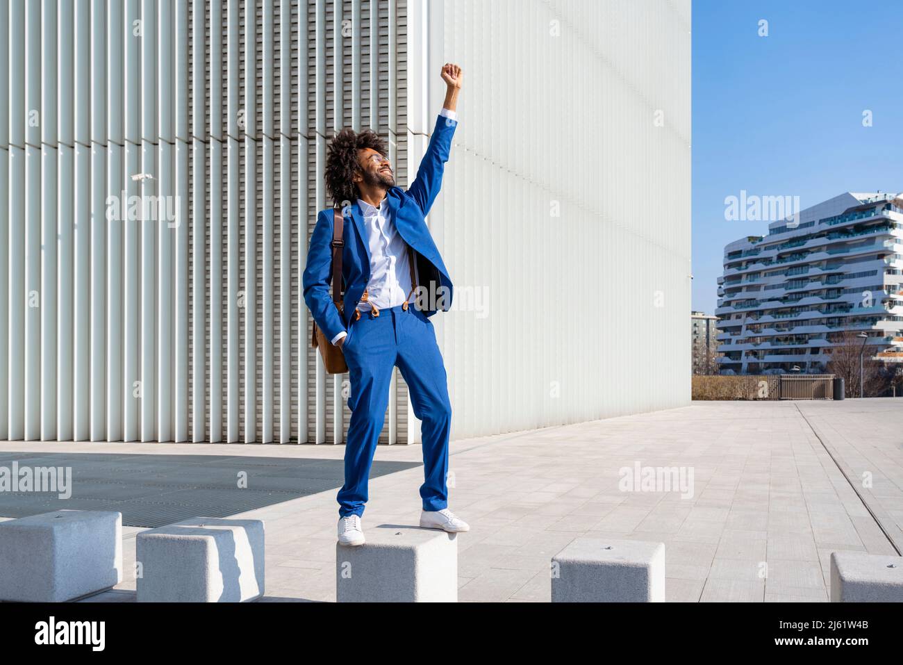 Businessman standing with his hand raised hi-res stock photography and ...