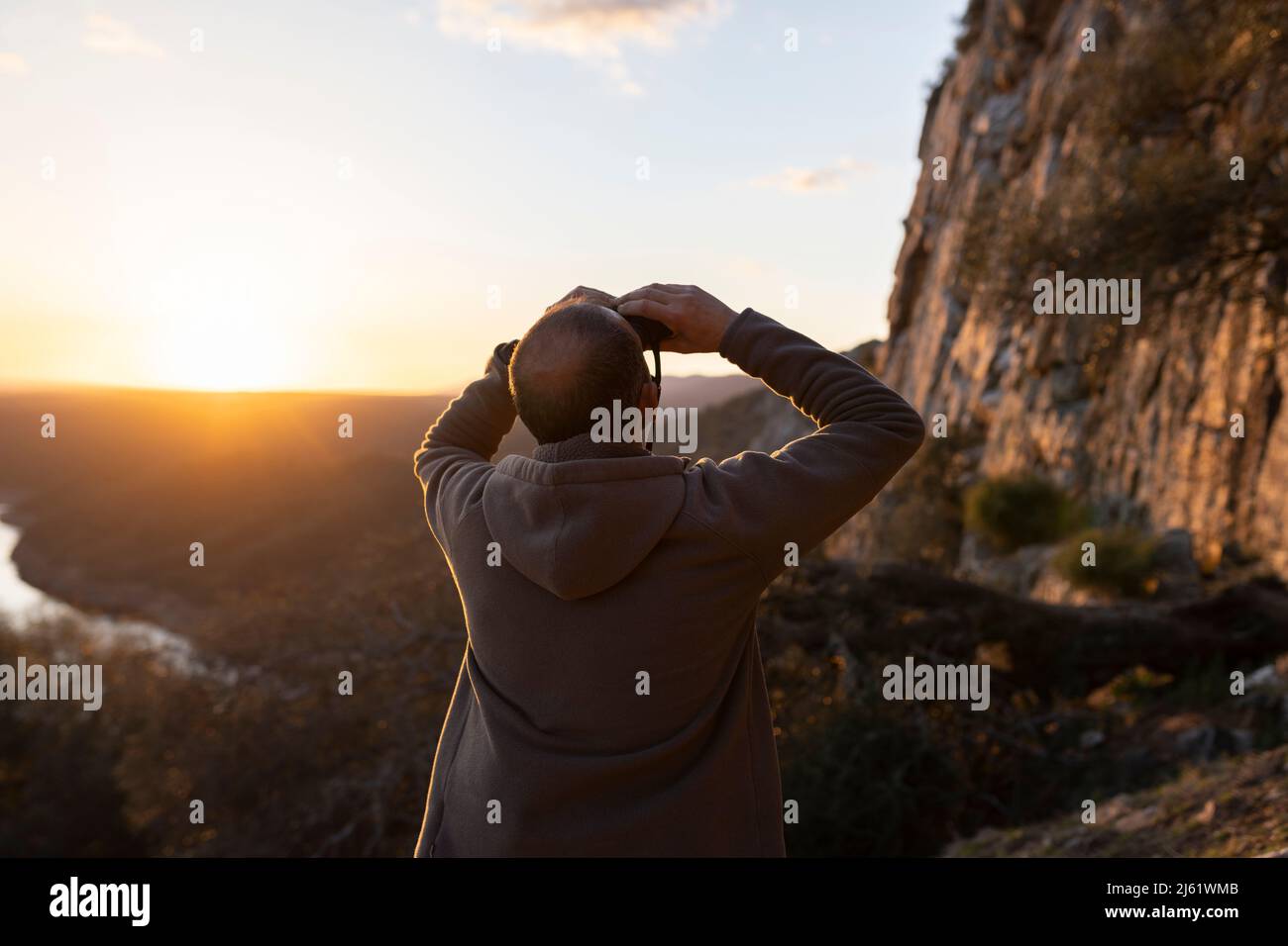Man bird watching in Monfrague National Park at sunset Stock Photo - Alamy