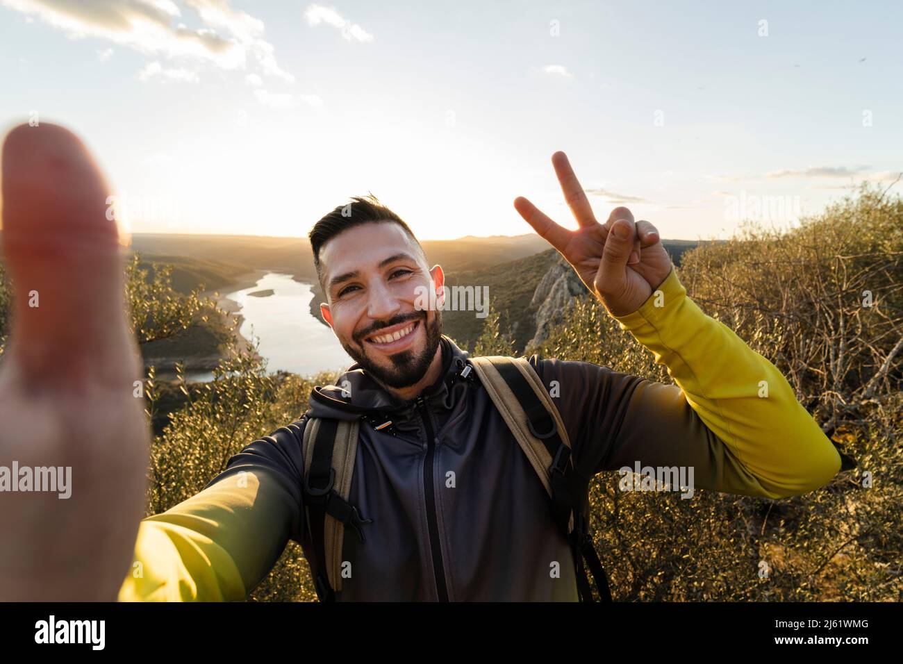Male hand making peace sign hi-res stock photography and images - Alamy
