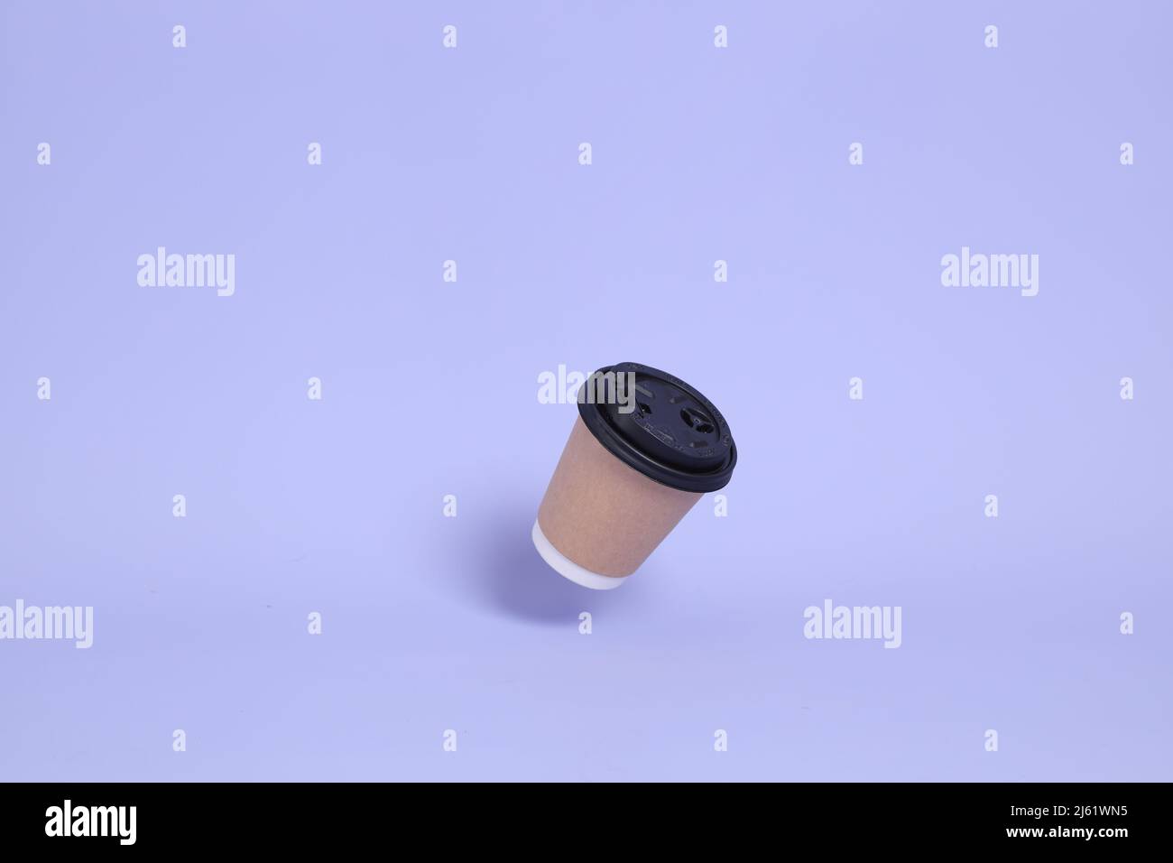 The isolated picture of cup floating on the purple background Stock ...