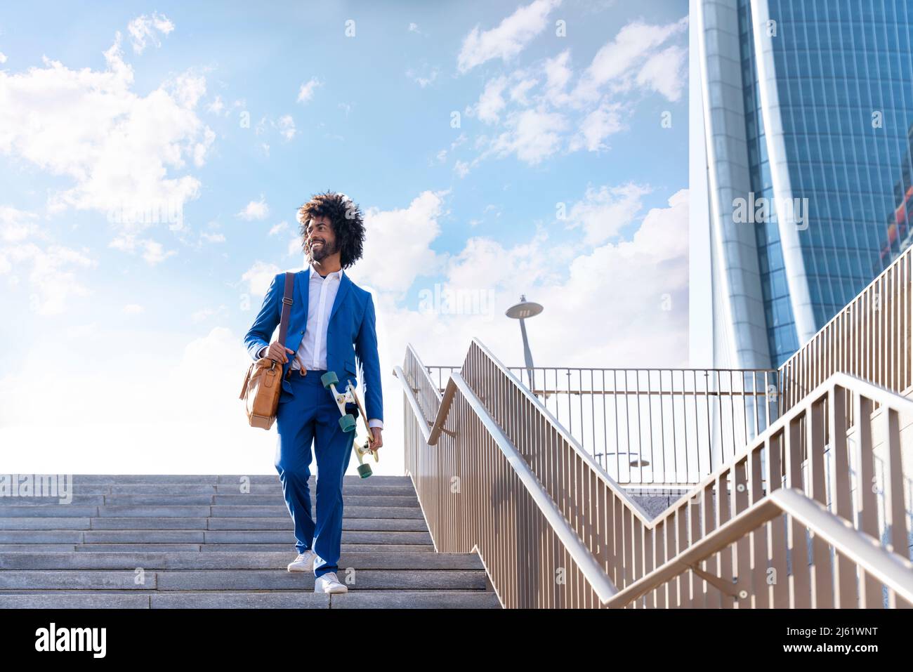 Smart man walking down steps hi-res stock photography and images - Alamy