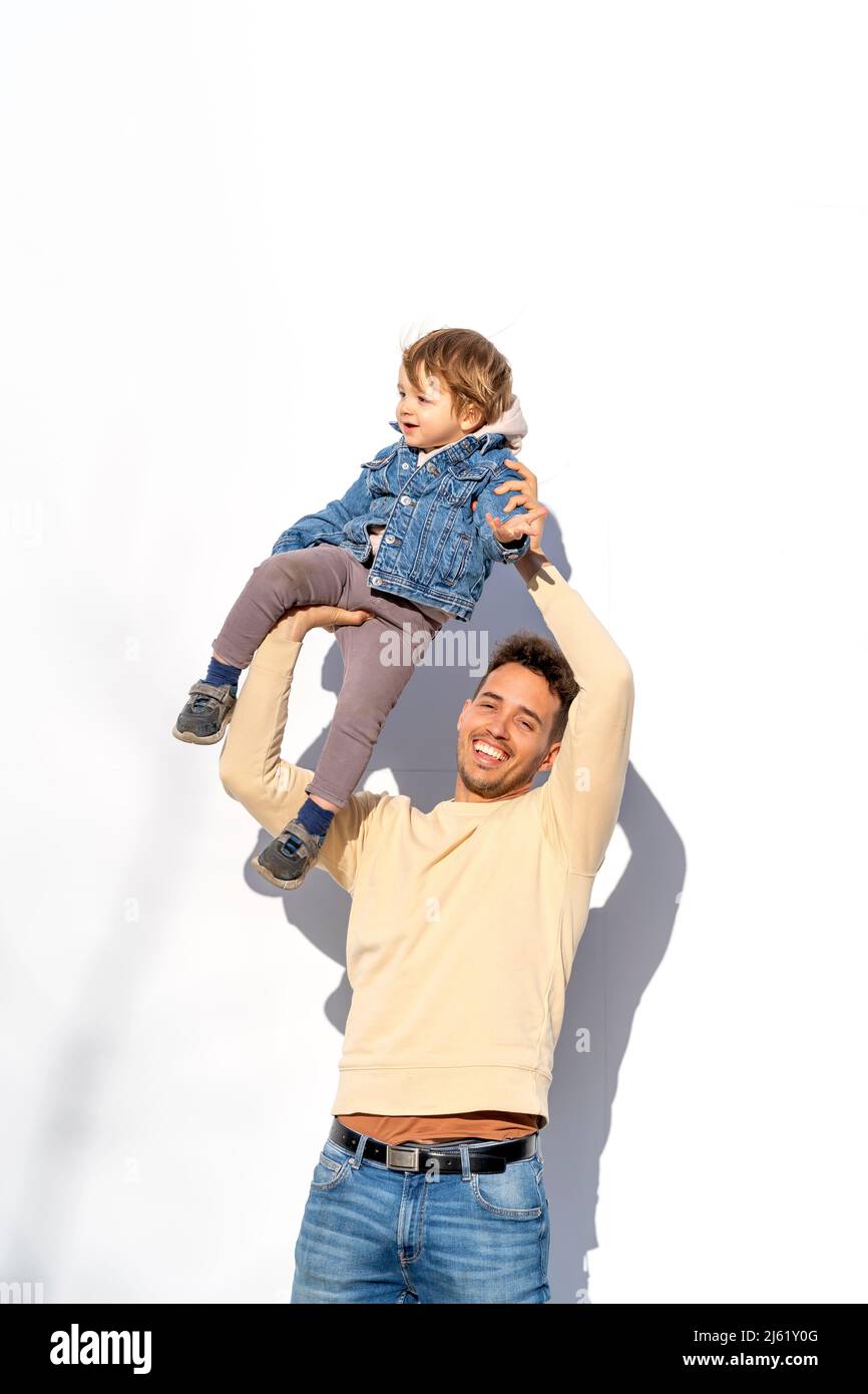 Man lifting children hi-res stock photography and images - Alamy