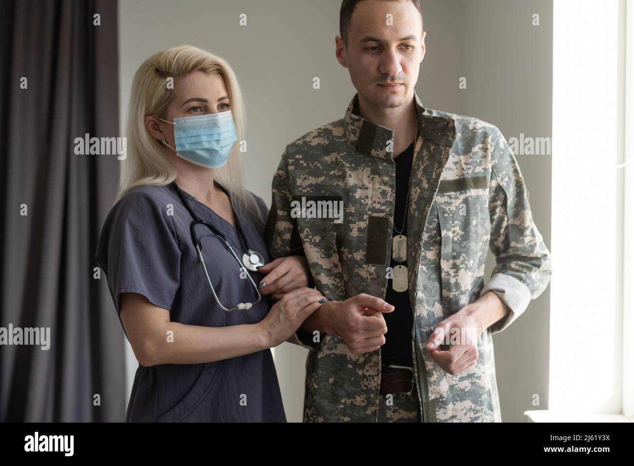 medical worker with military officer patient in hospital Stock Photo ...