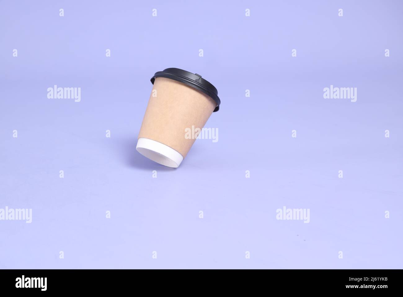 The isolated picture of cup floating on the purple background Stock ...