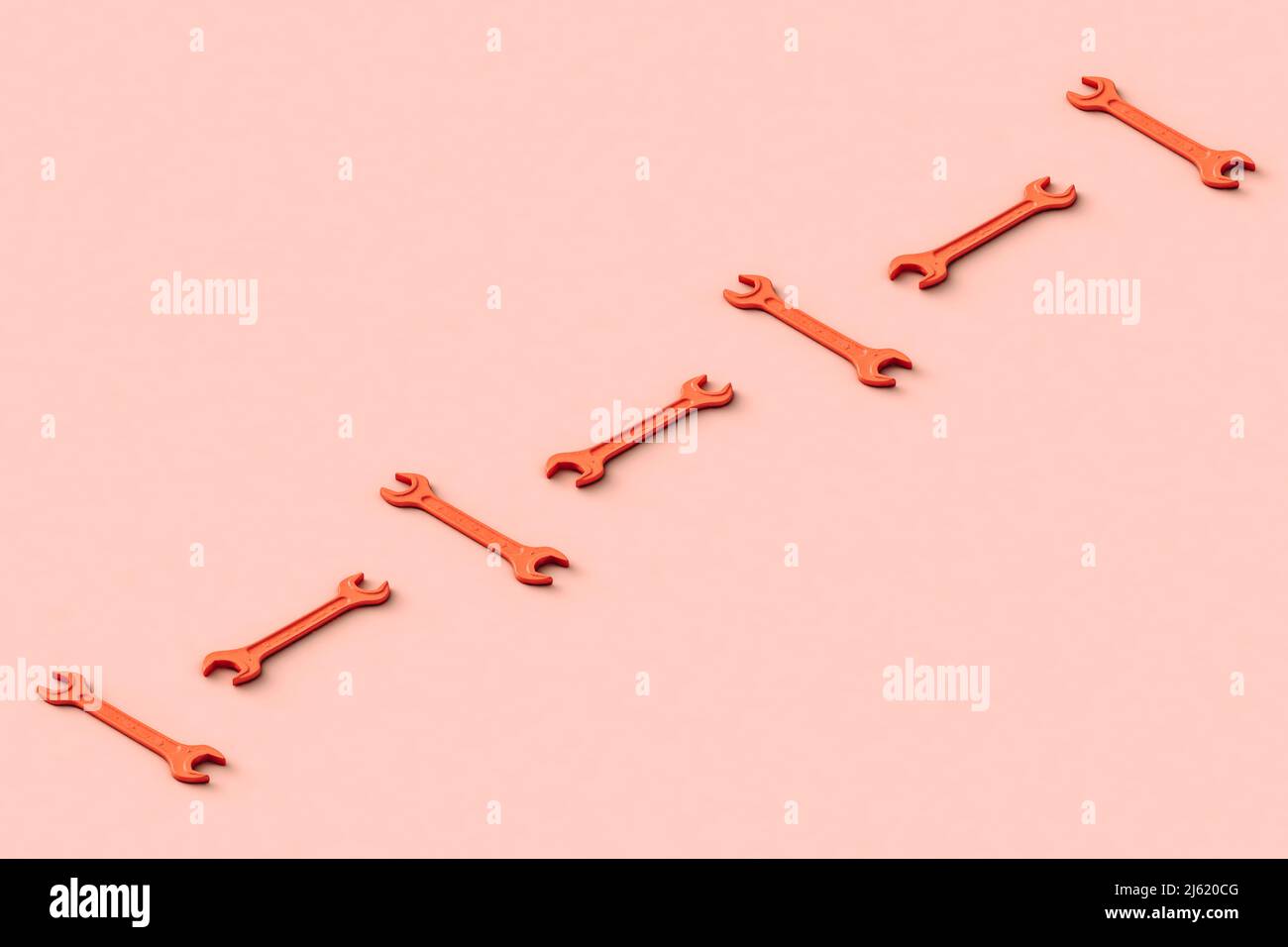 Three dimensional render of row of orange colored wrenches flat laid ...