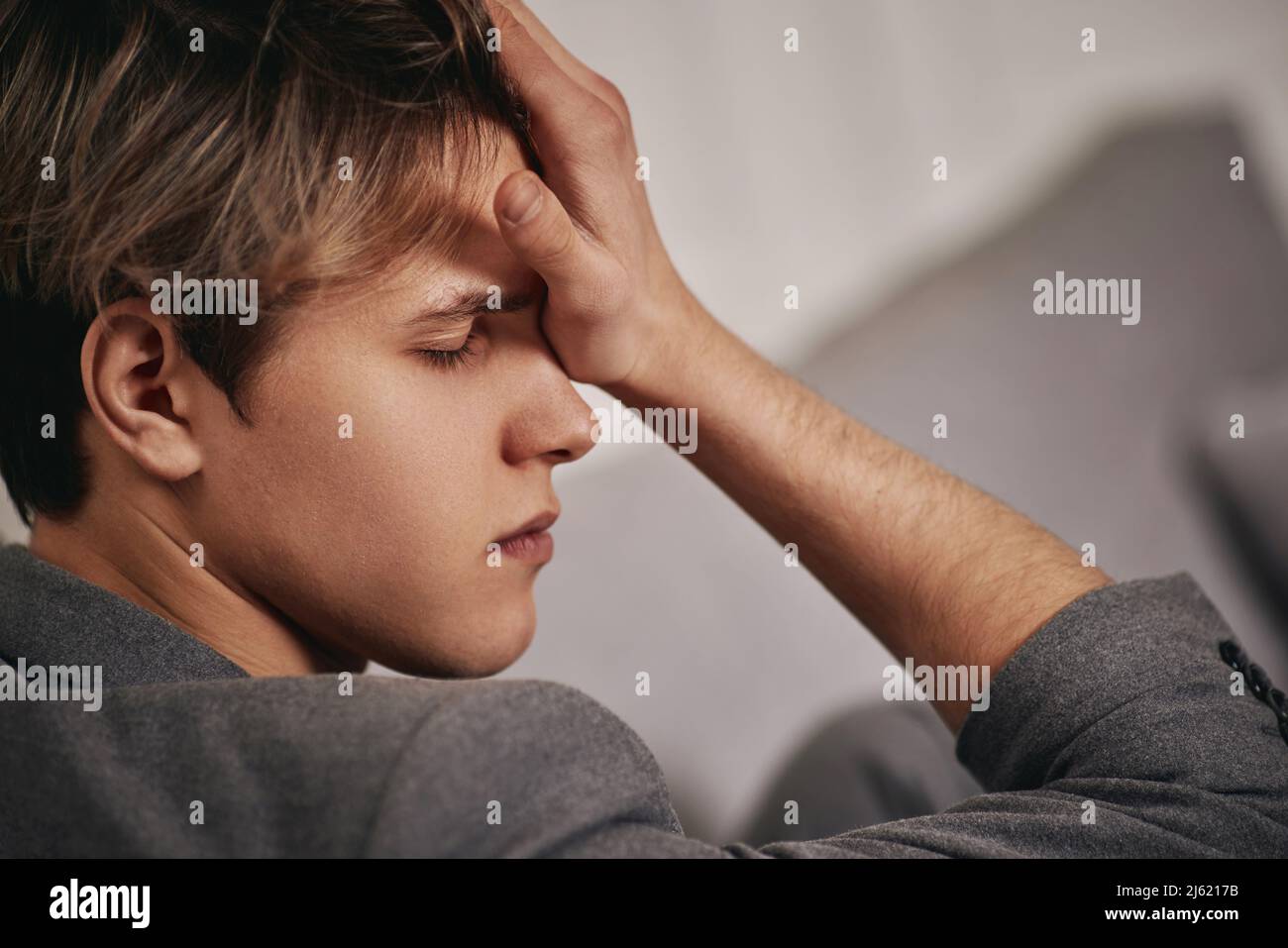 Depressed nervous man sitting home hi-res stock photography and images ...