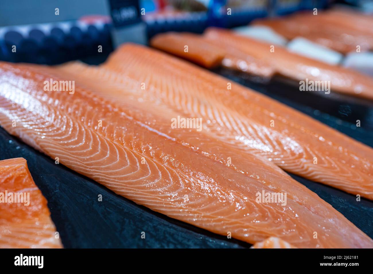 Fresh salmon fillet for sale on display in supermarket, close up Stock ...