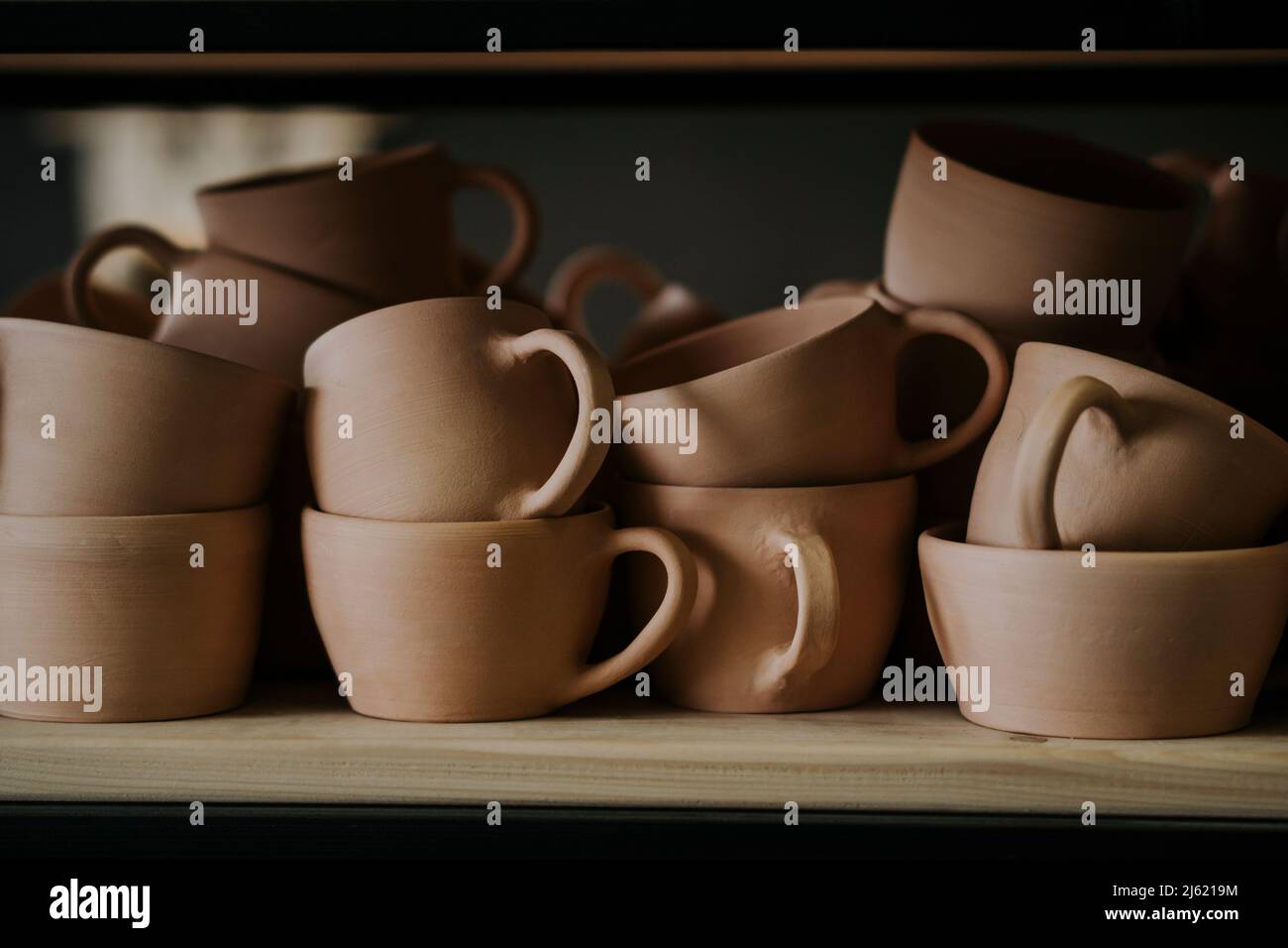 Earthenware cups on shelf hi-res stock photography and images - Alamy