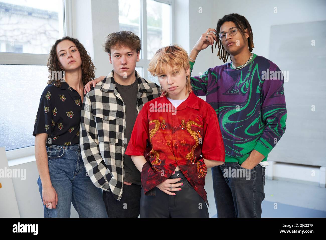 Young friends standing together hi-res stock photography and images - Alamy