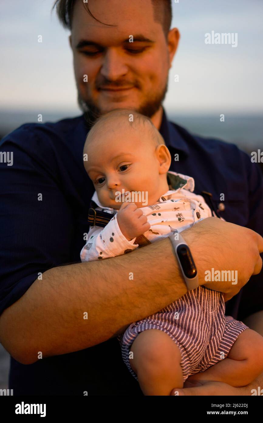 Father holding two babies outdoors hi-res stock photography and images ...