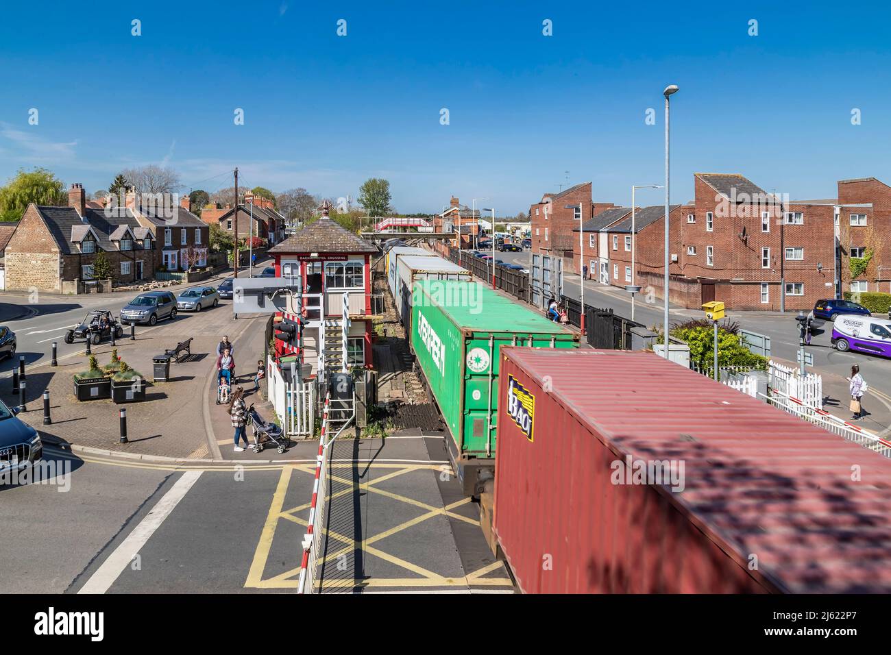 Container train going through Oakham station on a afternoon, looking ...