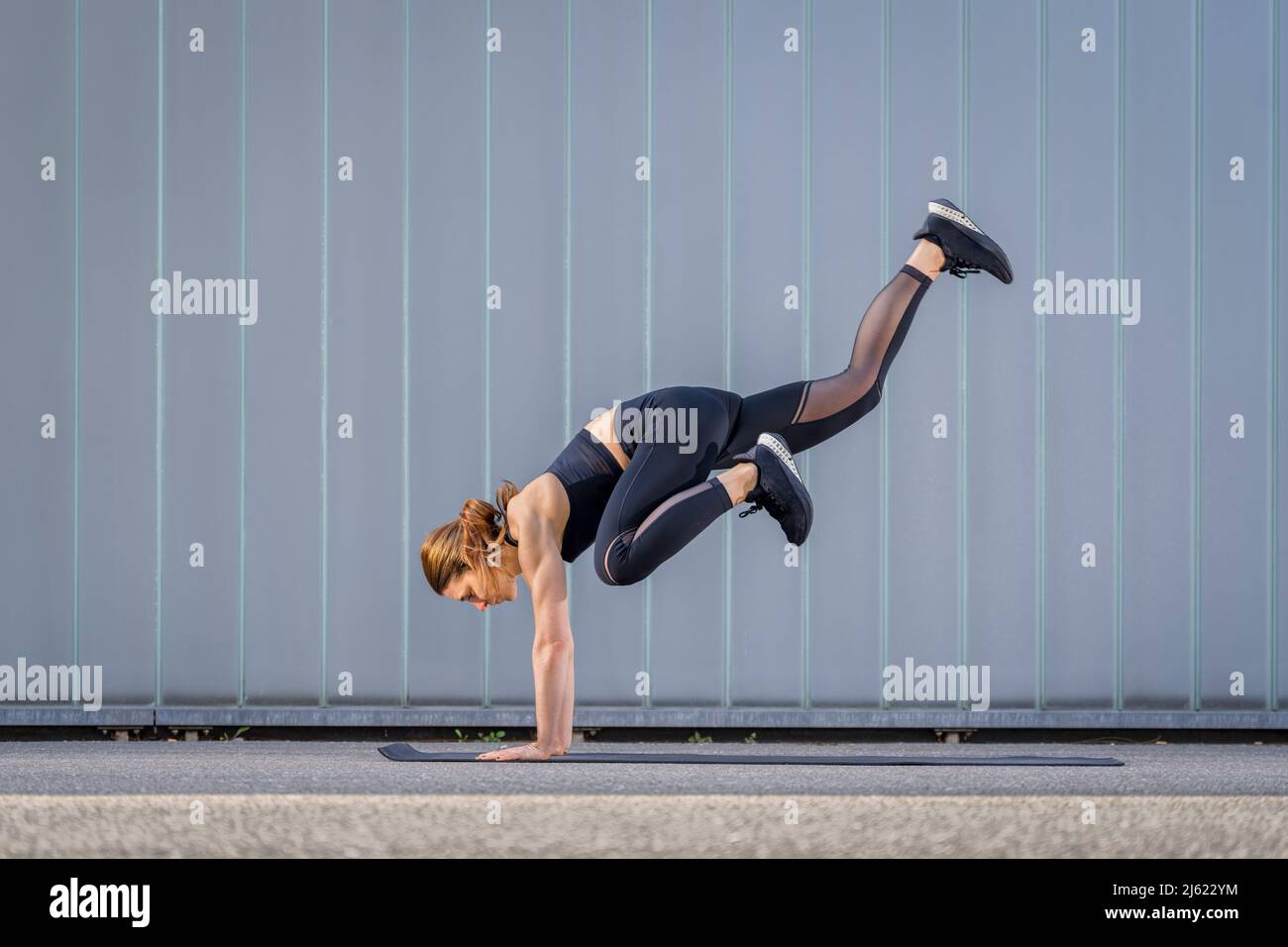 Balancing on hands hi-res stock photography and images - Alamy