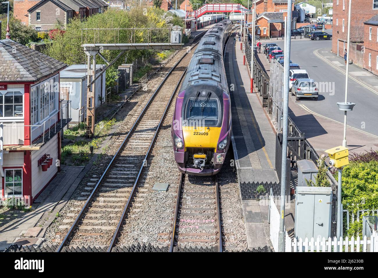 Diesel-electric passenger train leaving Oakham station, looking down ...