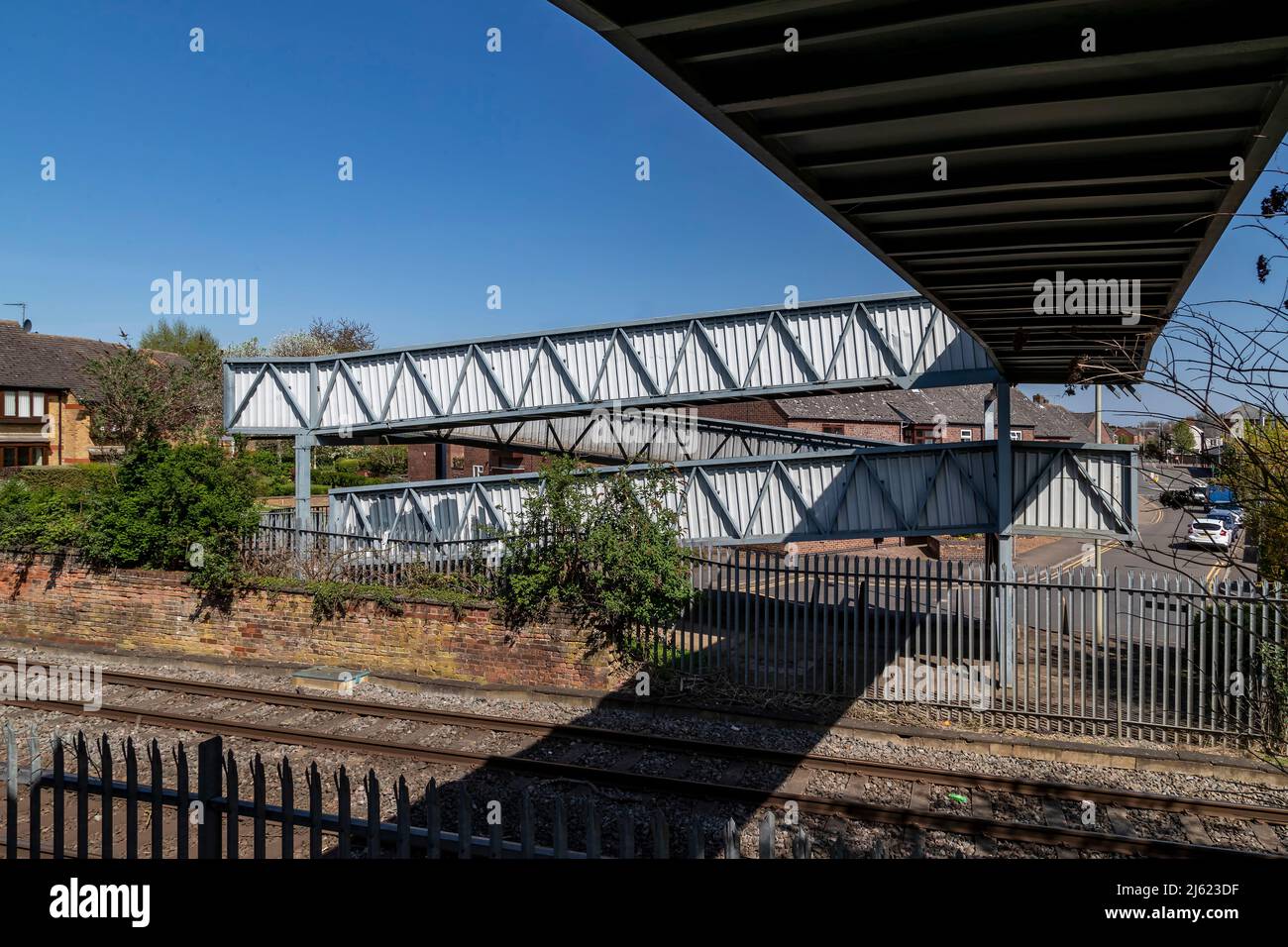 Metal public walkway over the railway lines in Oakham, Rutland ...