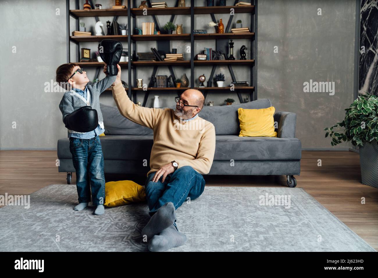Boy with boxing gloves hi-res stock photography and images - Alamy