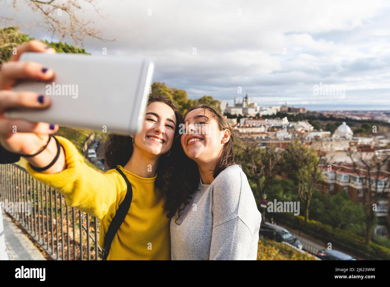 Happy friends taking selfie through smart phone on sunny day Stock ...
