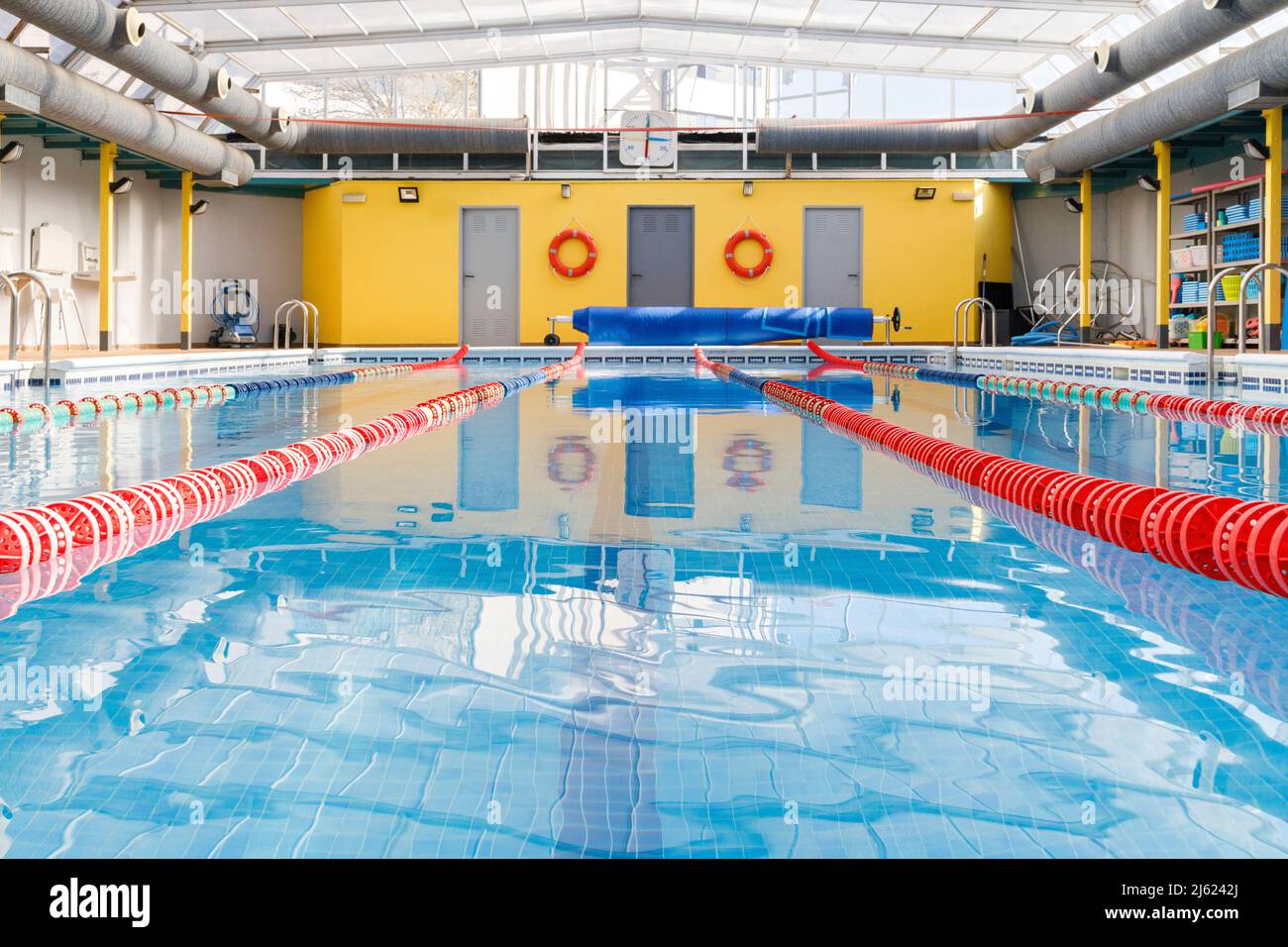 Empty pool with swimmer lanes in blue water Stock Photo - Alamy