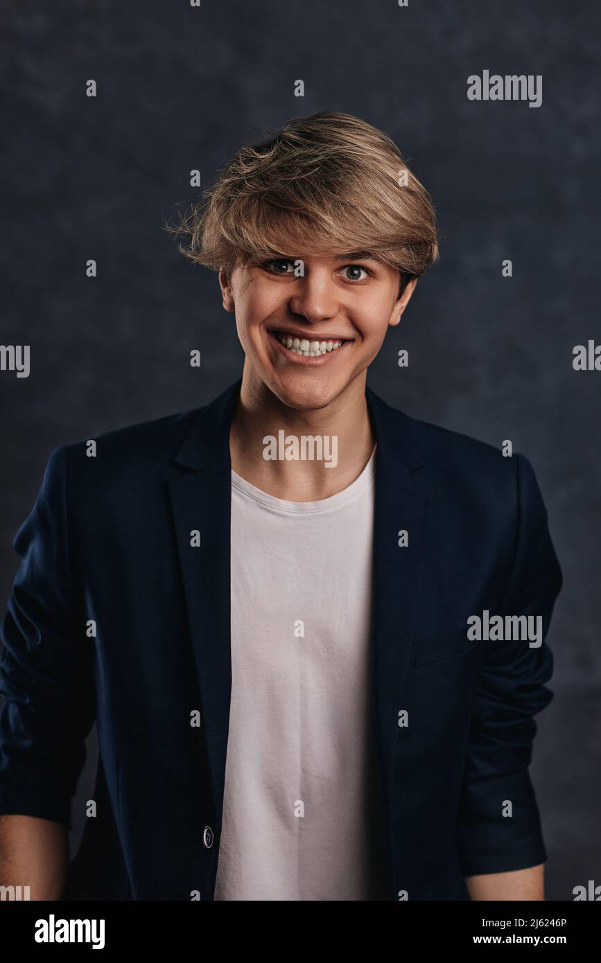 guy with modern haircut is staring at the camera Stock Photo - Alamy