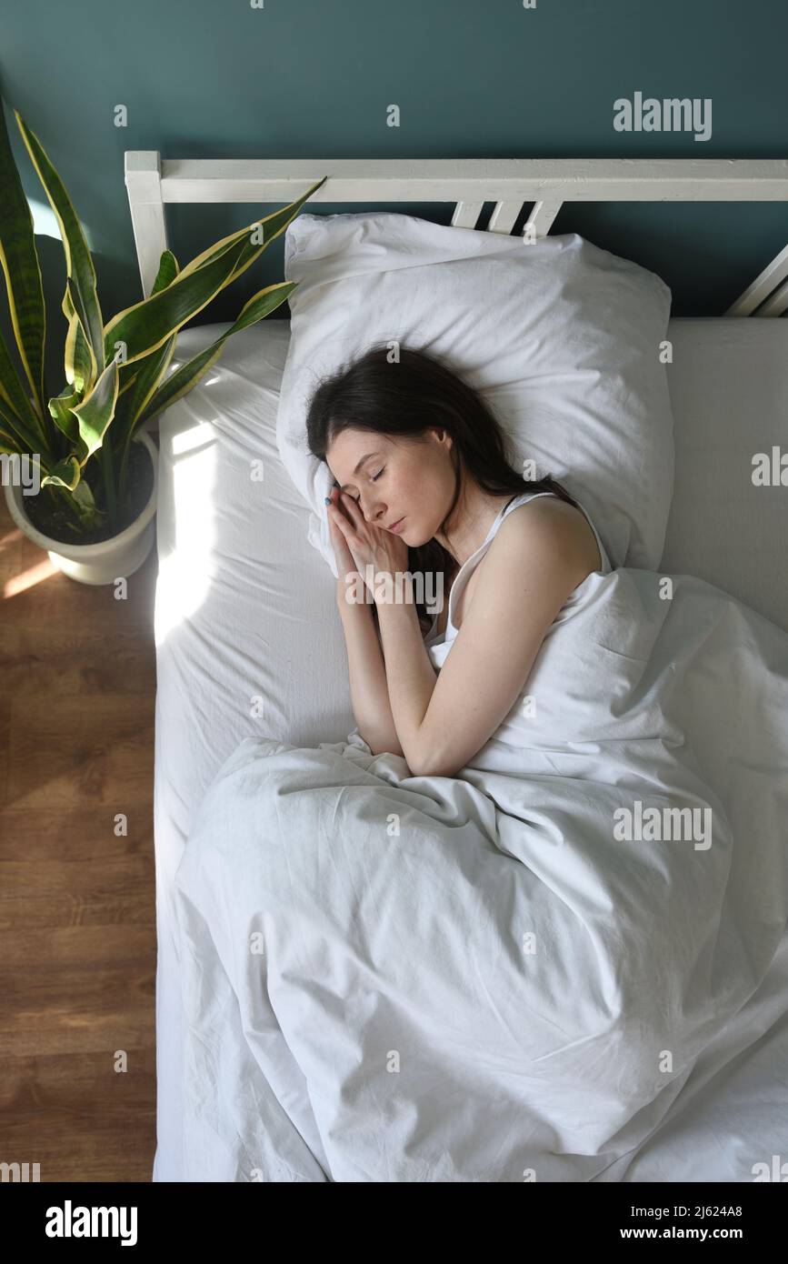Woman sleeping in bedroom at home Stock Photo - Alamy