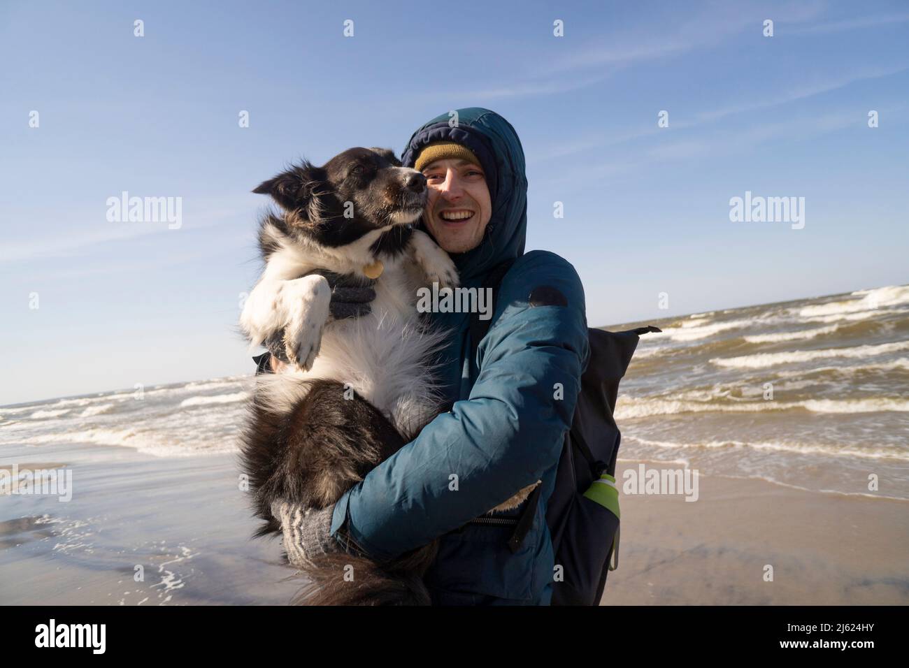 Man carrying his dog hi-res stock photography and images - Alamy
