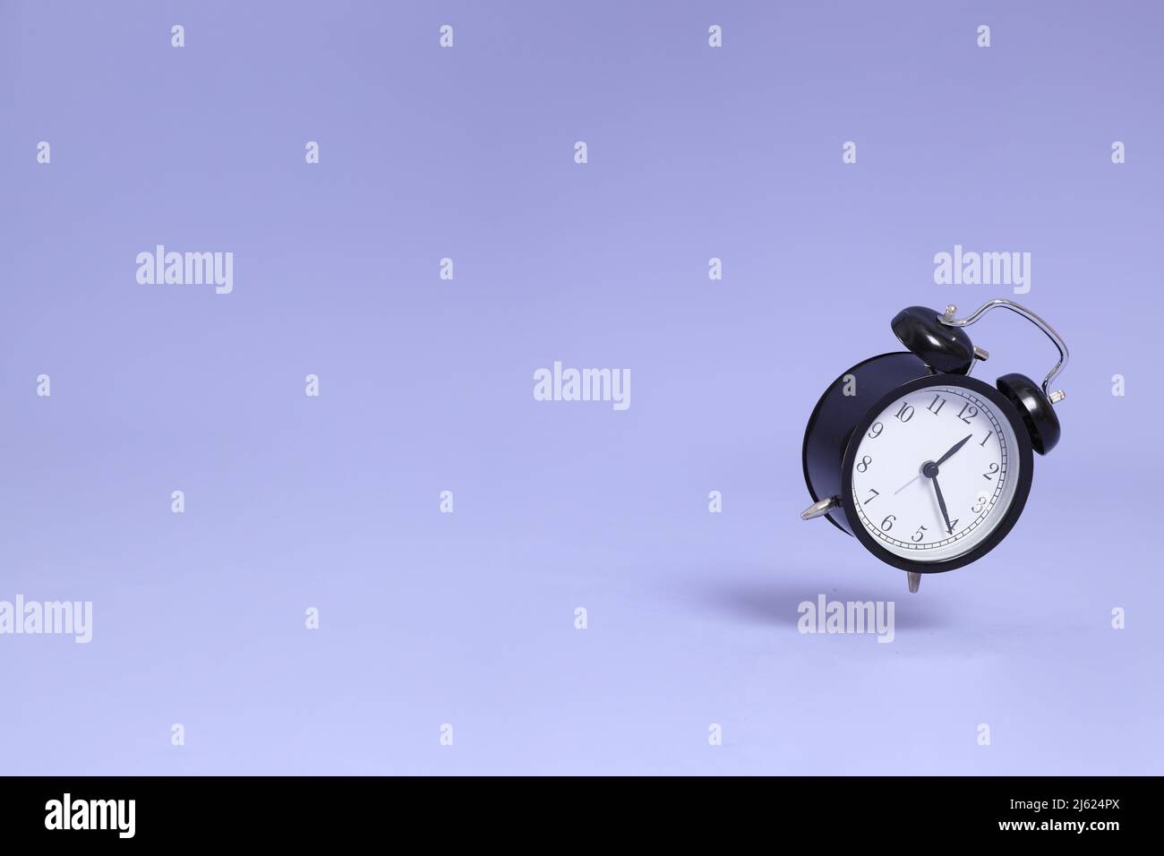 The isolated picture of clock floating on the purple background Stock ...