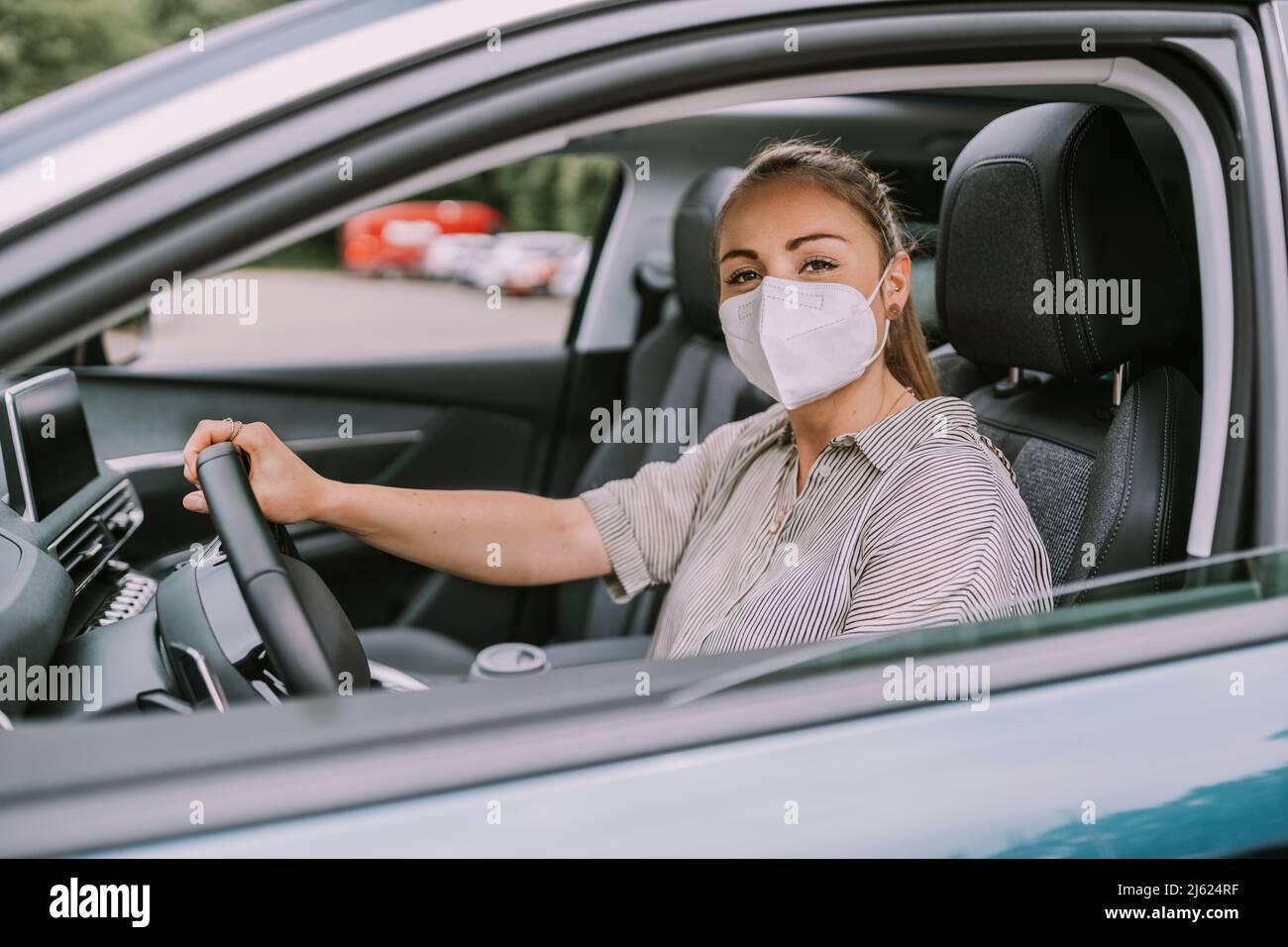 Woman face mask car hi-res stock photography and images - Alamy