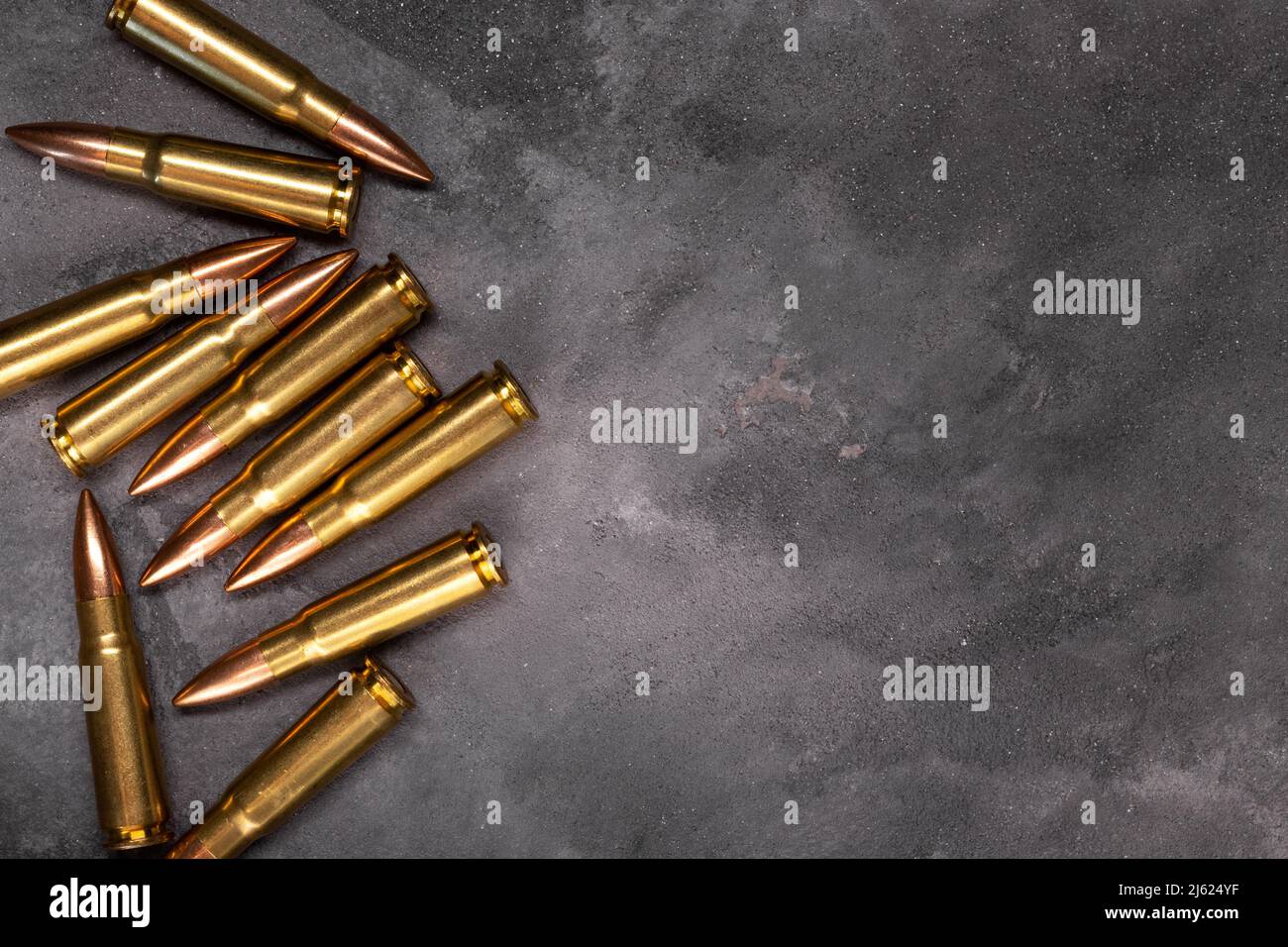 Bullets on gray background. Cartridges 7.62 caliber for Kalashnikov ...