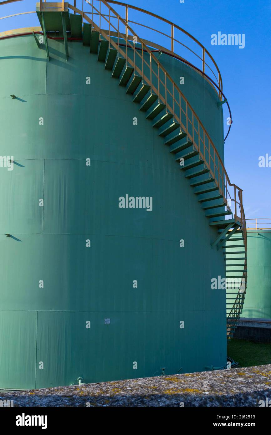 View of storage tank and pipes of chemical industry, Italy Stock Photo ...