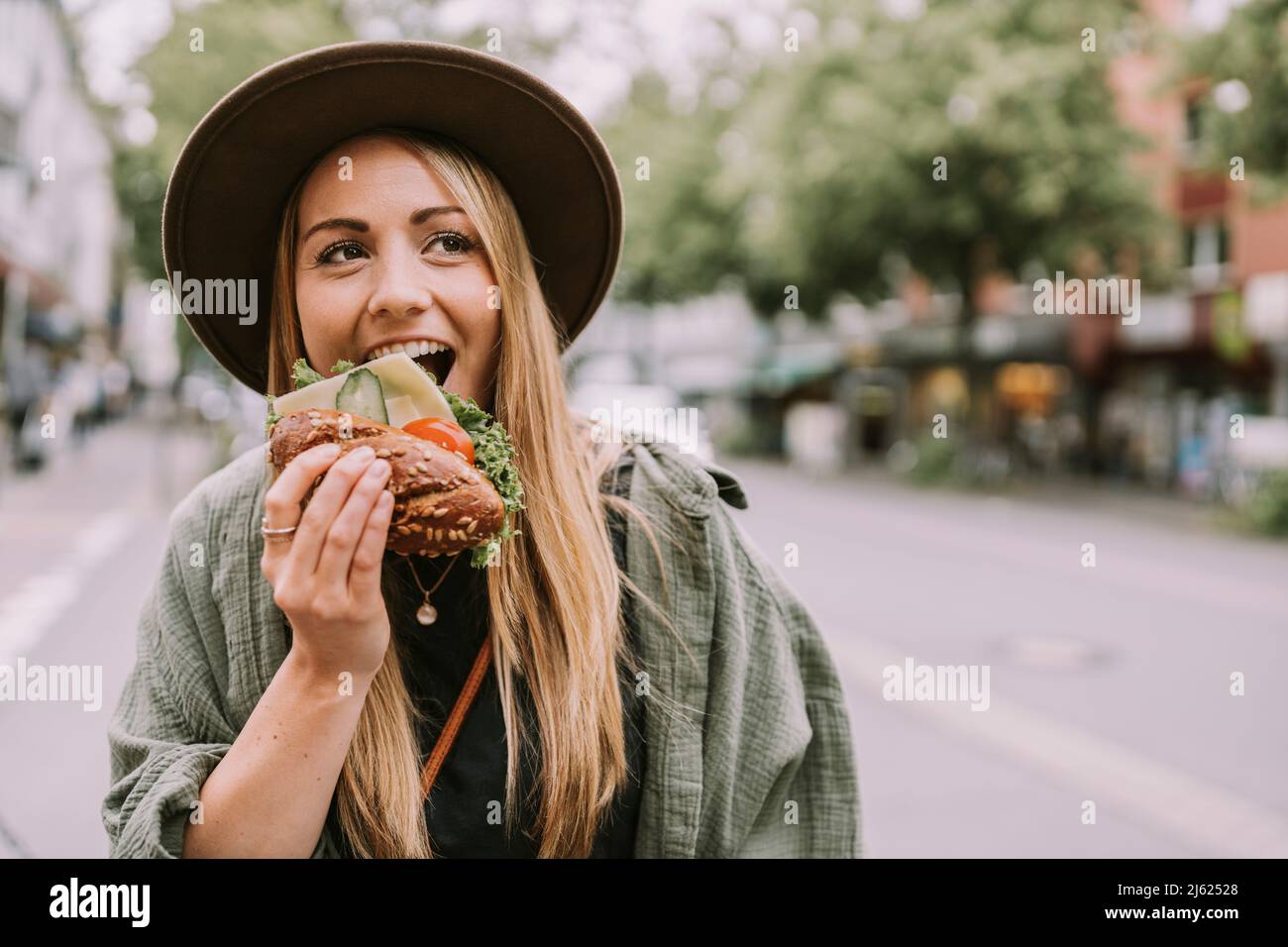 Woman eating hat hi-res stock photography and images - Alamy