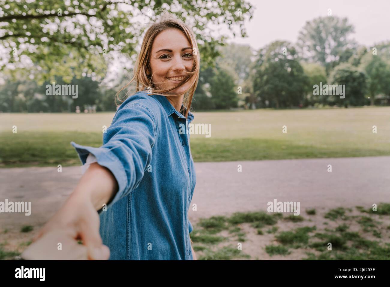 Woman pulling dress hi-res stock photography and images - Alamy