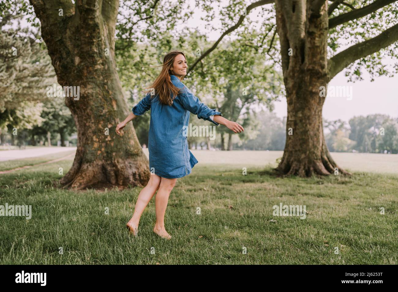 One woman spinning arms hi-res stock photography and images - Alamy