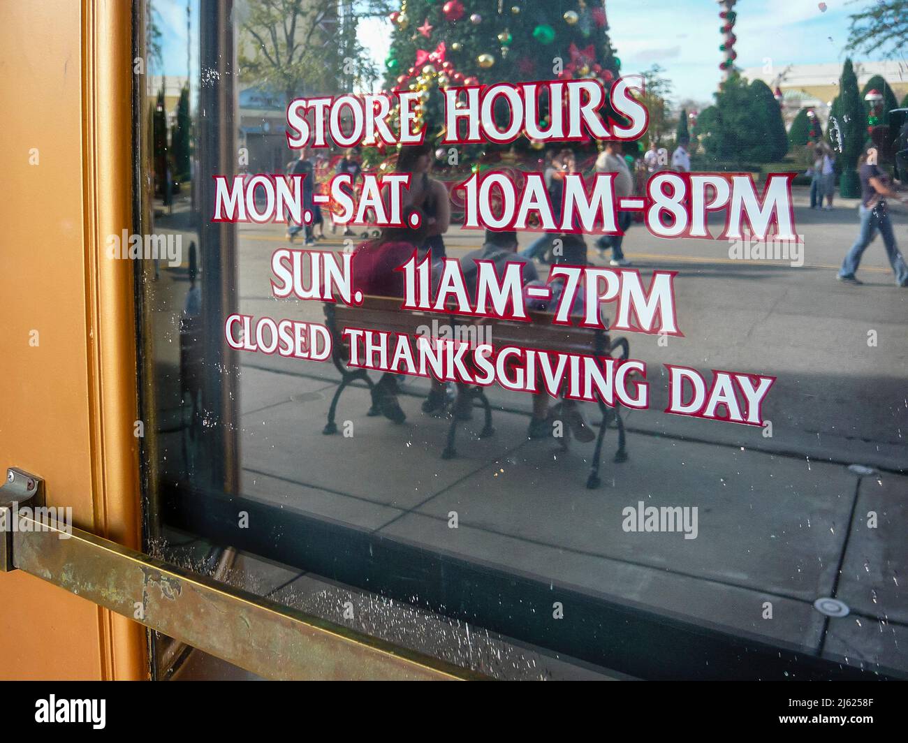 Shop opening hours on the door of a shop in Florida Stock Photo - Alamy