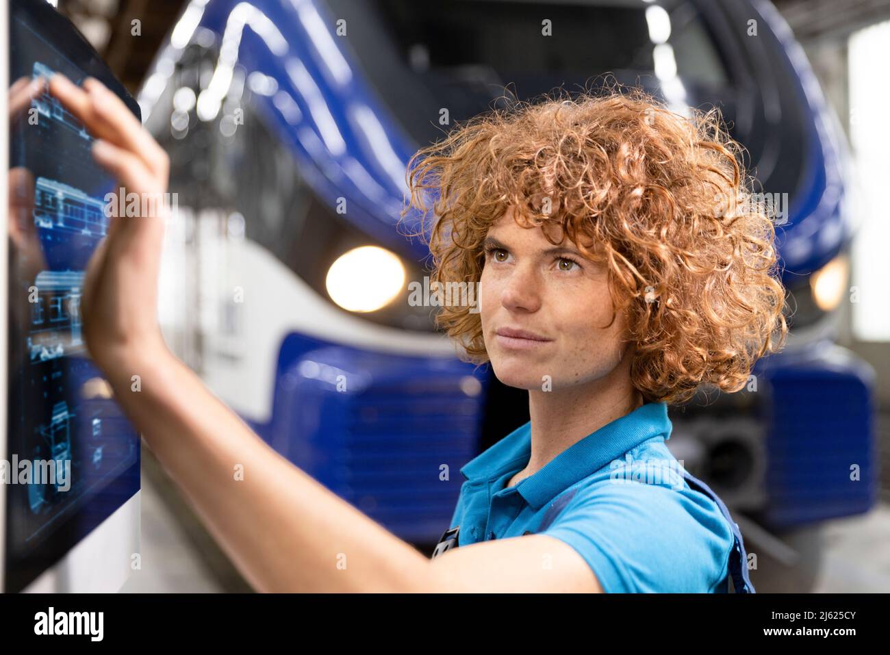 Engineer using touch screen device in factory Stock Photo - Alamy