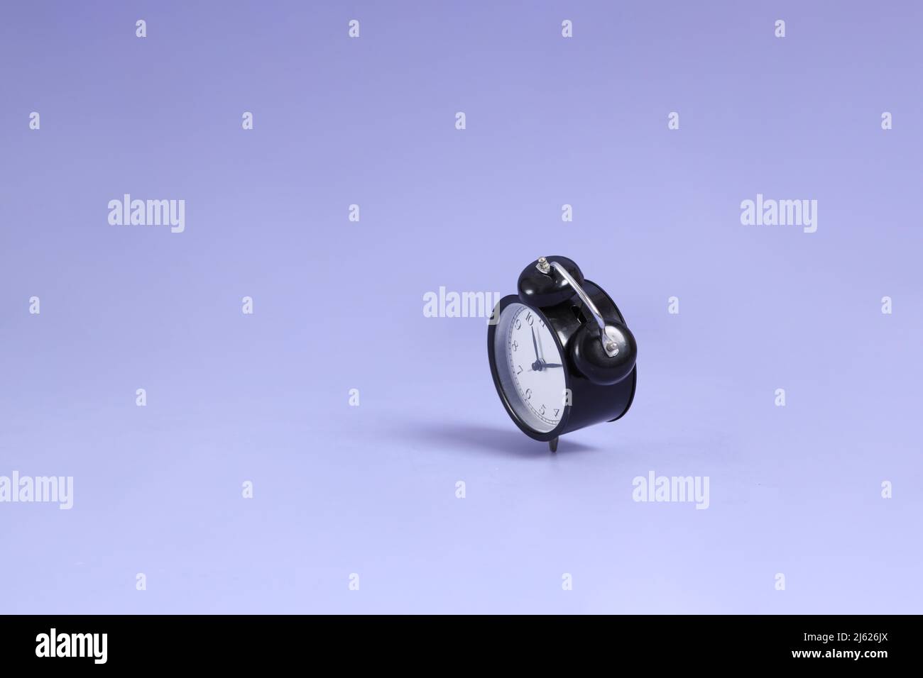 The isolated picture of clock floating on the purple background Stock ...