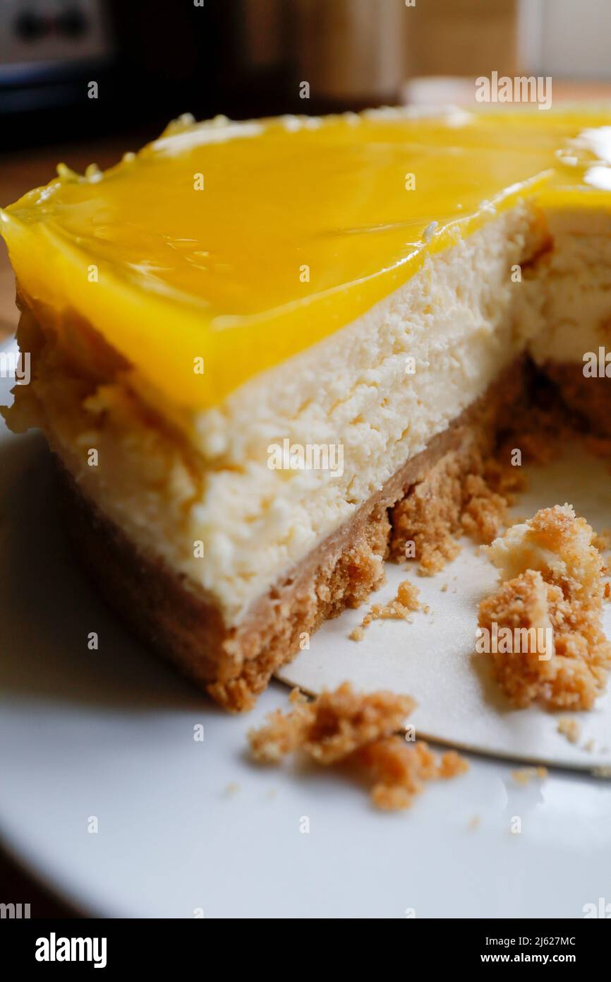 Lemon curd topped cheescake Stock Photo - Alamy