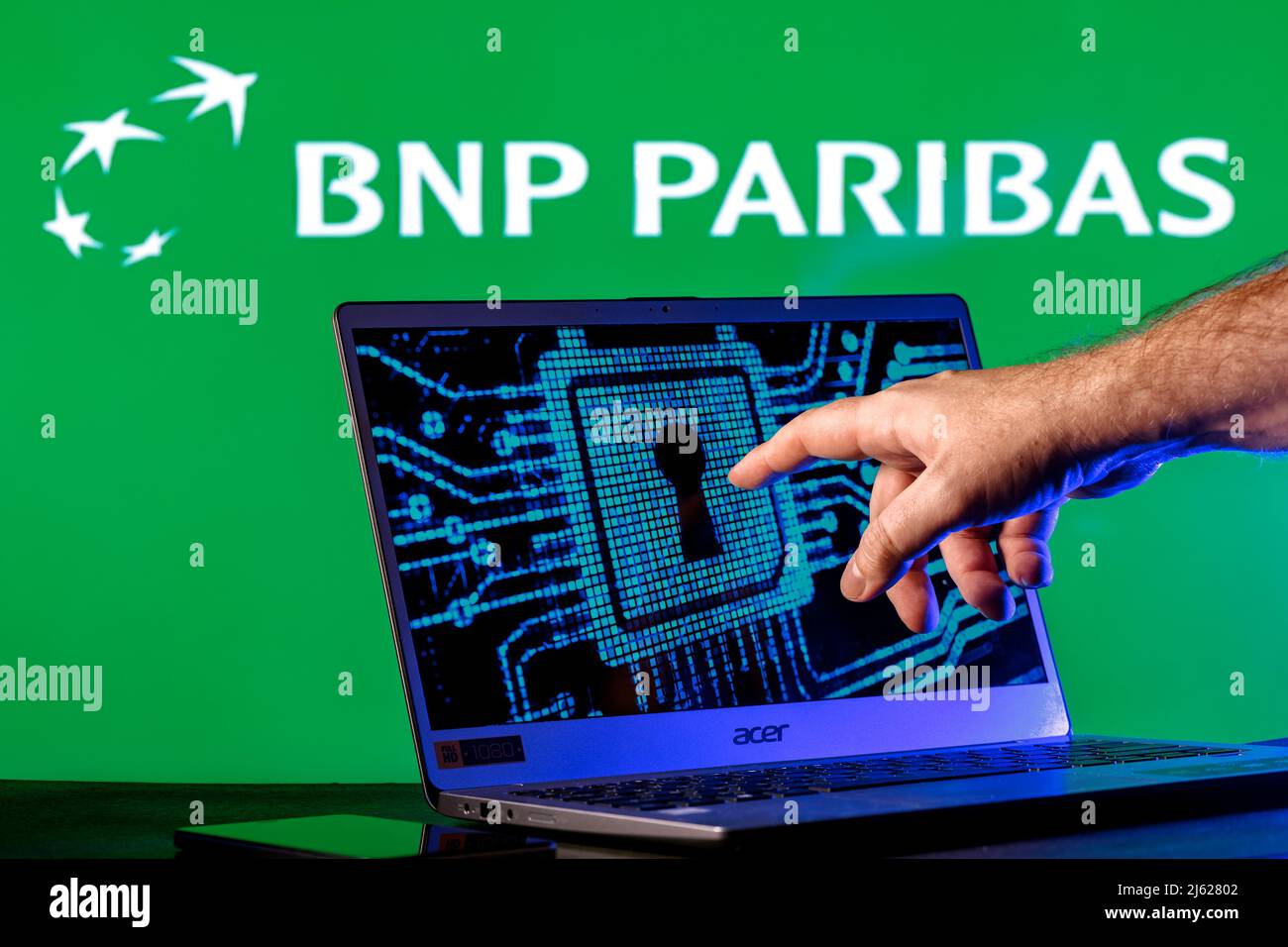Laptop with lock symbol on screen on background of BNP Paribas bank ...