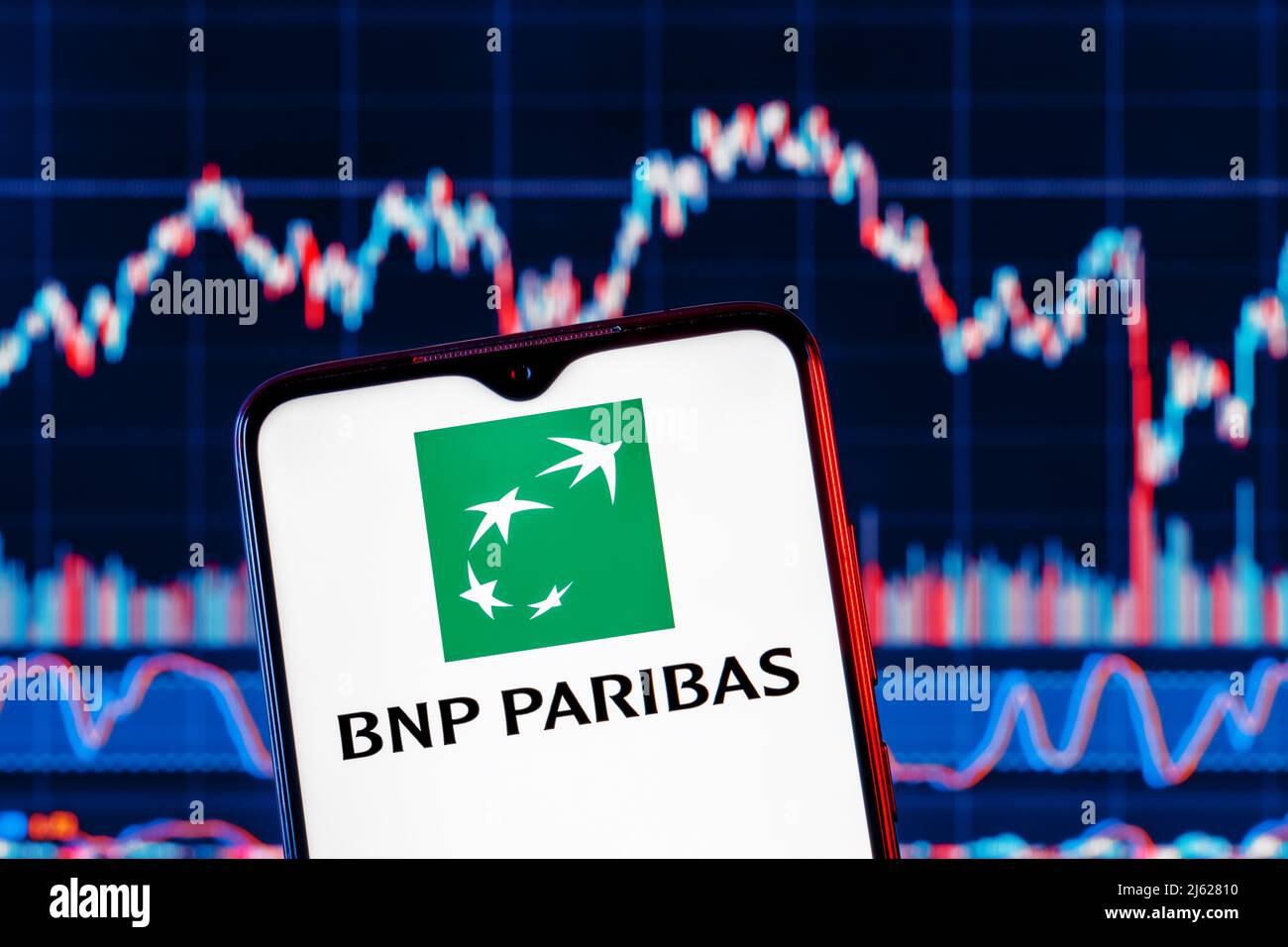 Smartphone with BNP Paribas bank logo. BNP Paribas stock chart on ...