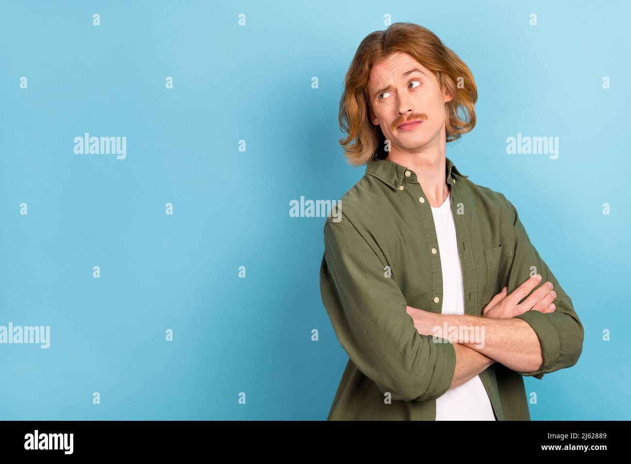 Portrait of attractive funky skeptic guy folded arms deciding copy ...