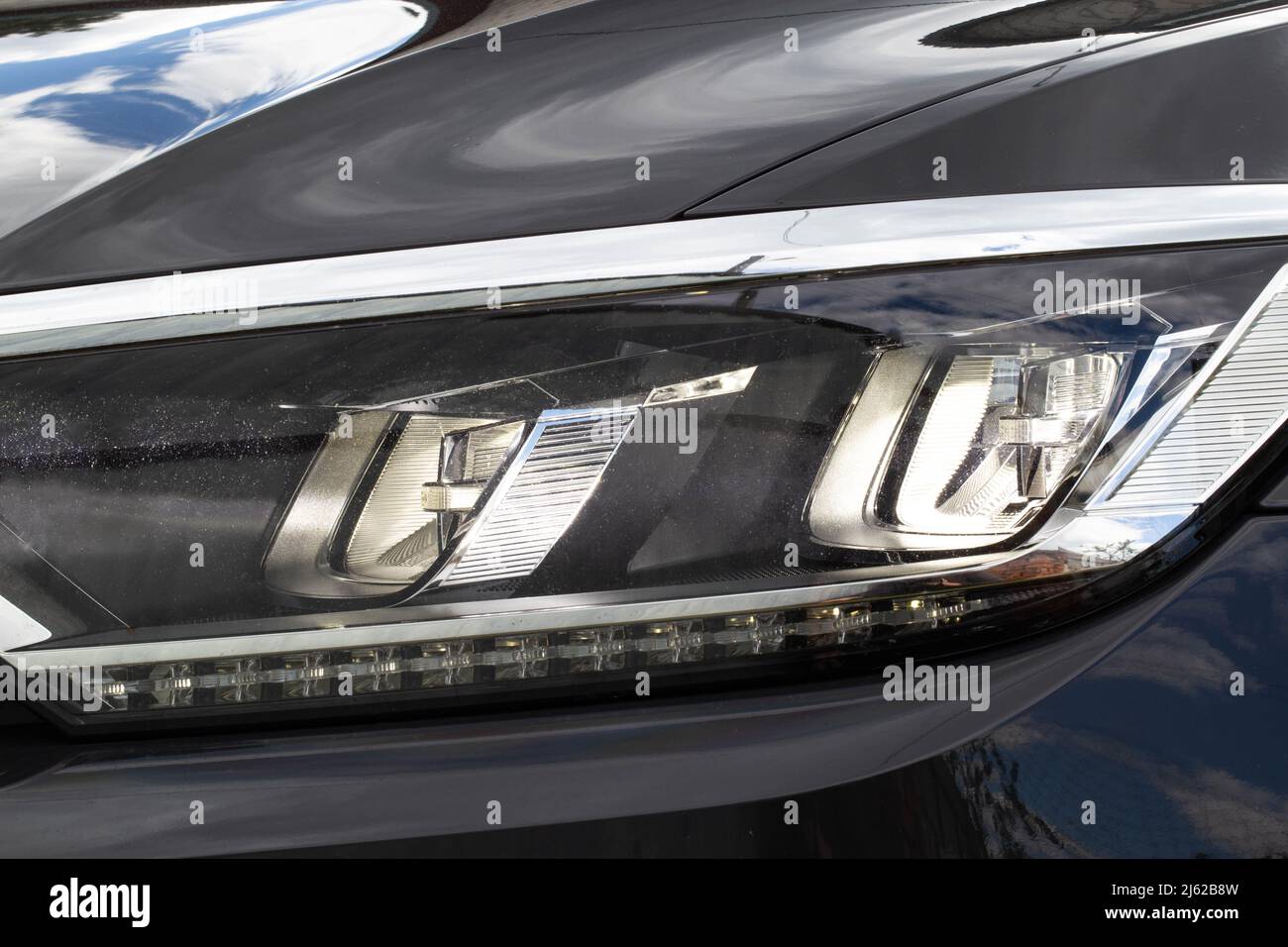 Economical and modern car headlight with LED adaptive light. Close-up ...