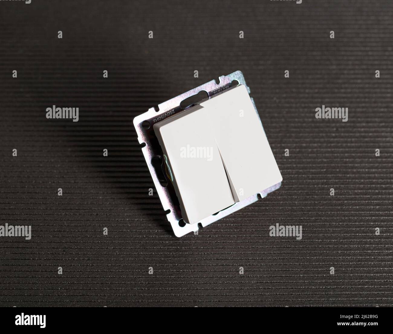 Modern two-gang switch on a gray background, close-up Stock Photo - Alamy
