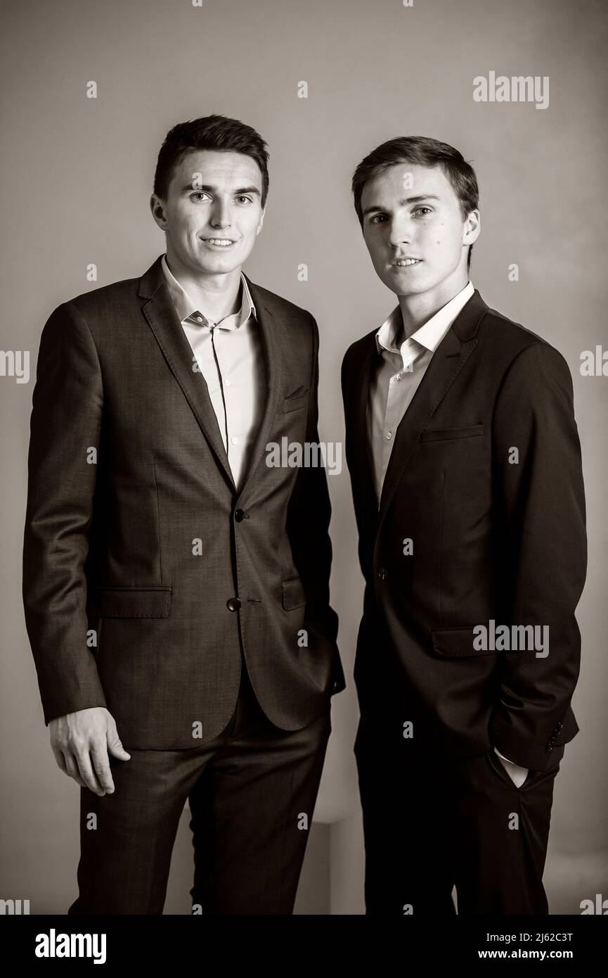 studio portrait of two young brothers in suits Stock Photo - Alamy