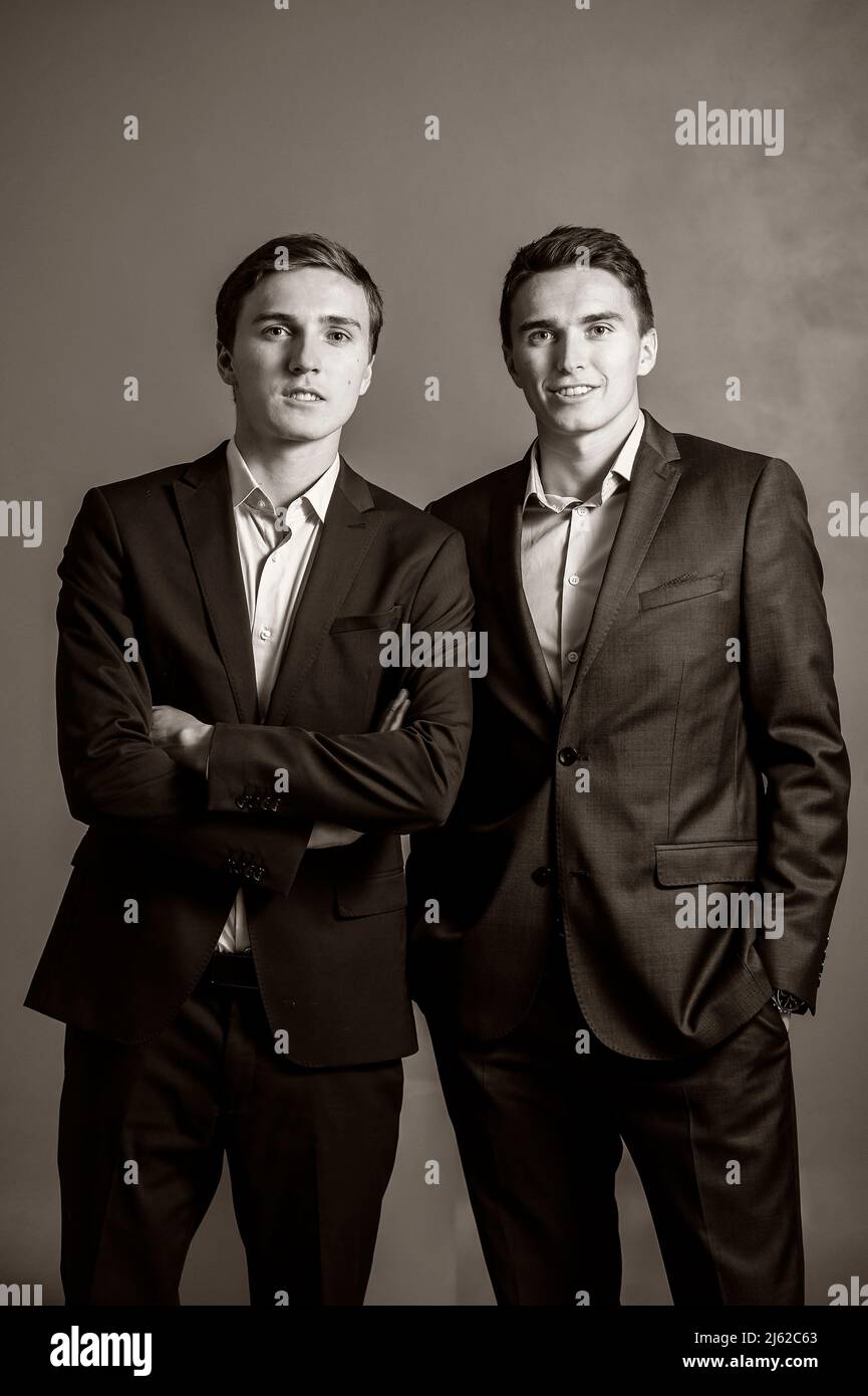 studio portrait of two young brothers in suits Stock Photo - Alamy
